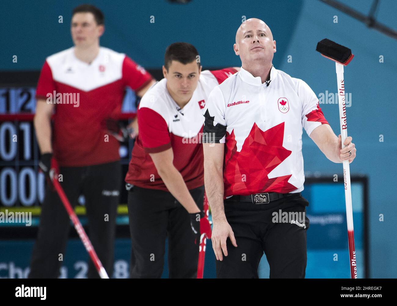Kevin Koe, right, of Canada reacts during men's bronze medal curling ...