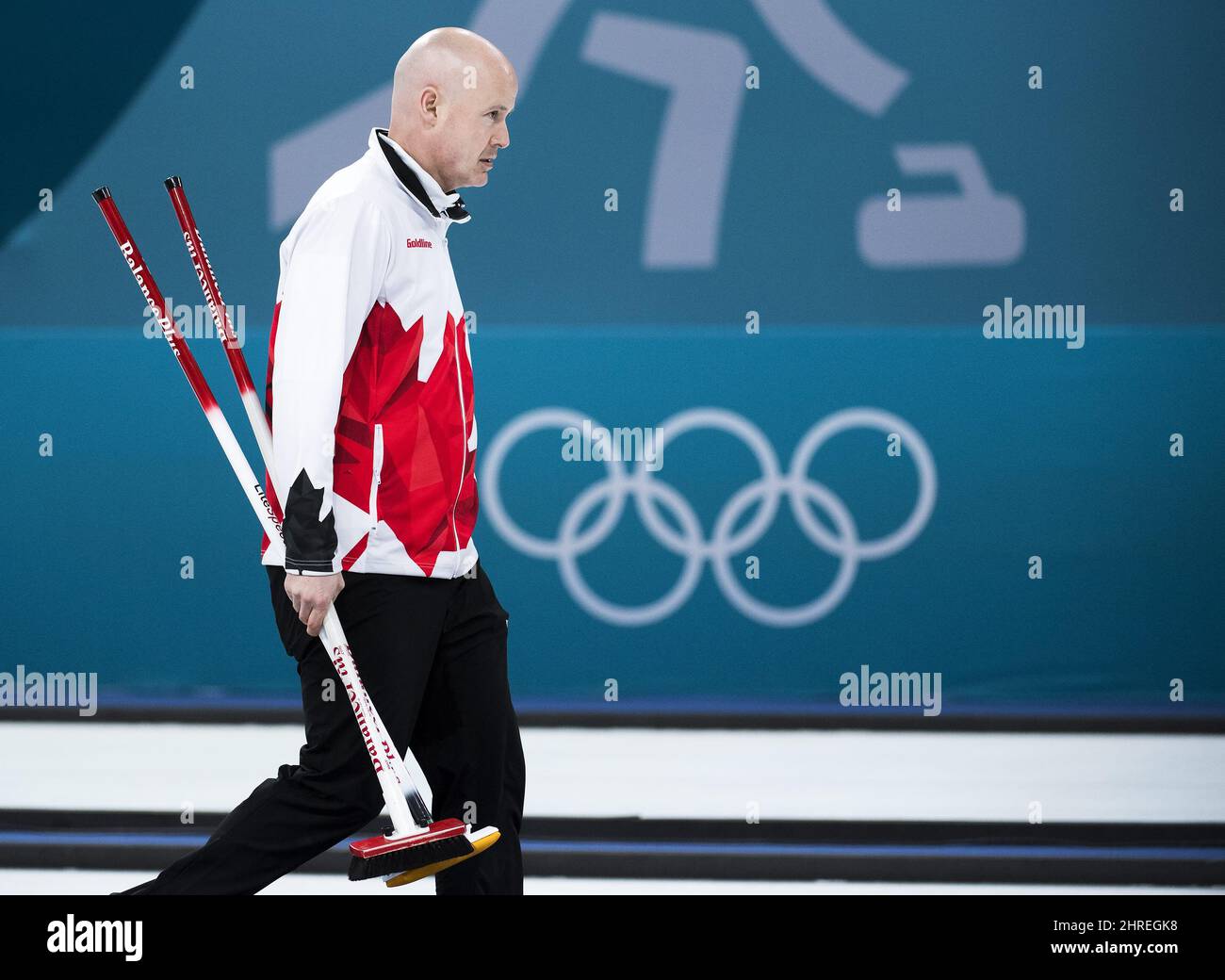 Kevin Koe of Canada looks on while playing against Switzerland during ...