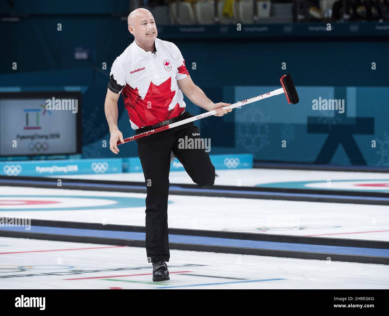 Kevin Koe of Canada reacts after throwing his rock during men's bronze ...