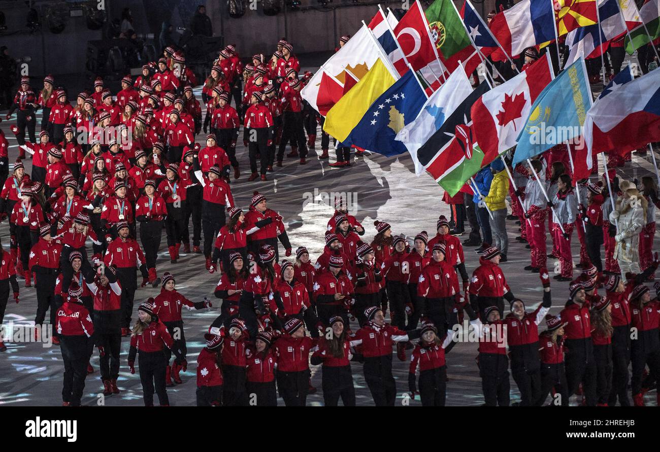 Canadian athletes walk into the Olympic stadium during the closing ...