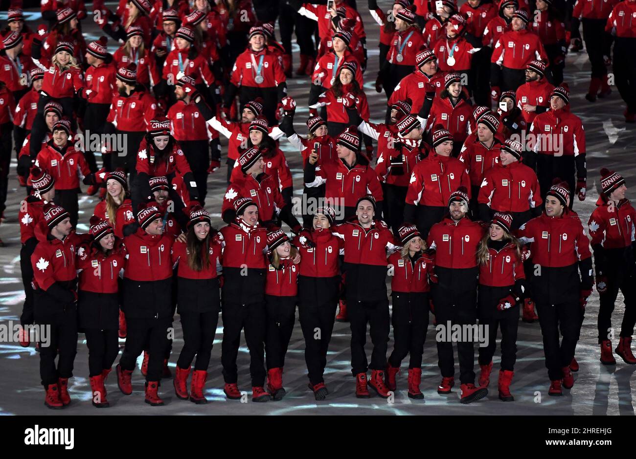 Canadian athletes walk into the Olympic stadium during the closing ...