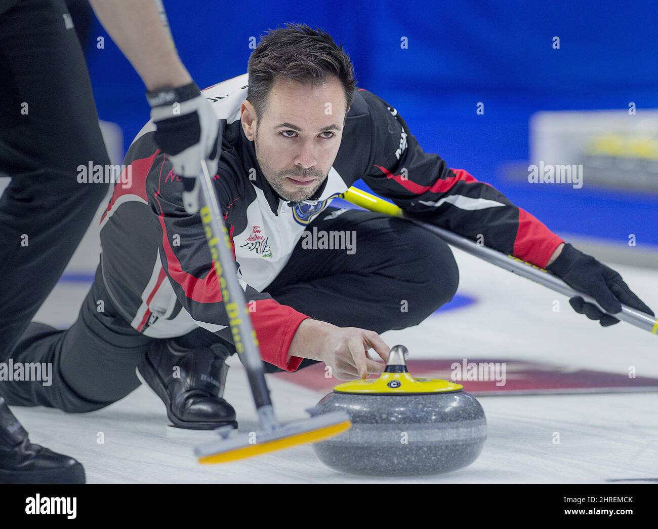 Ontario skip John Epping delivers a rock against Team Canada in the 1 ...