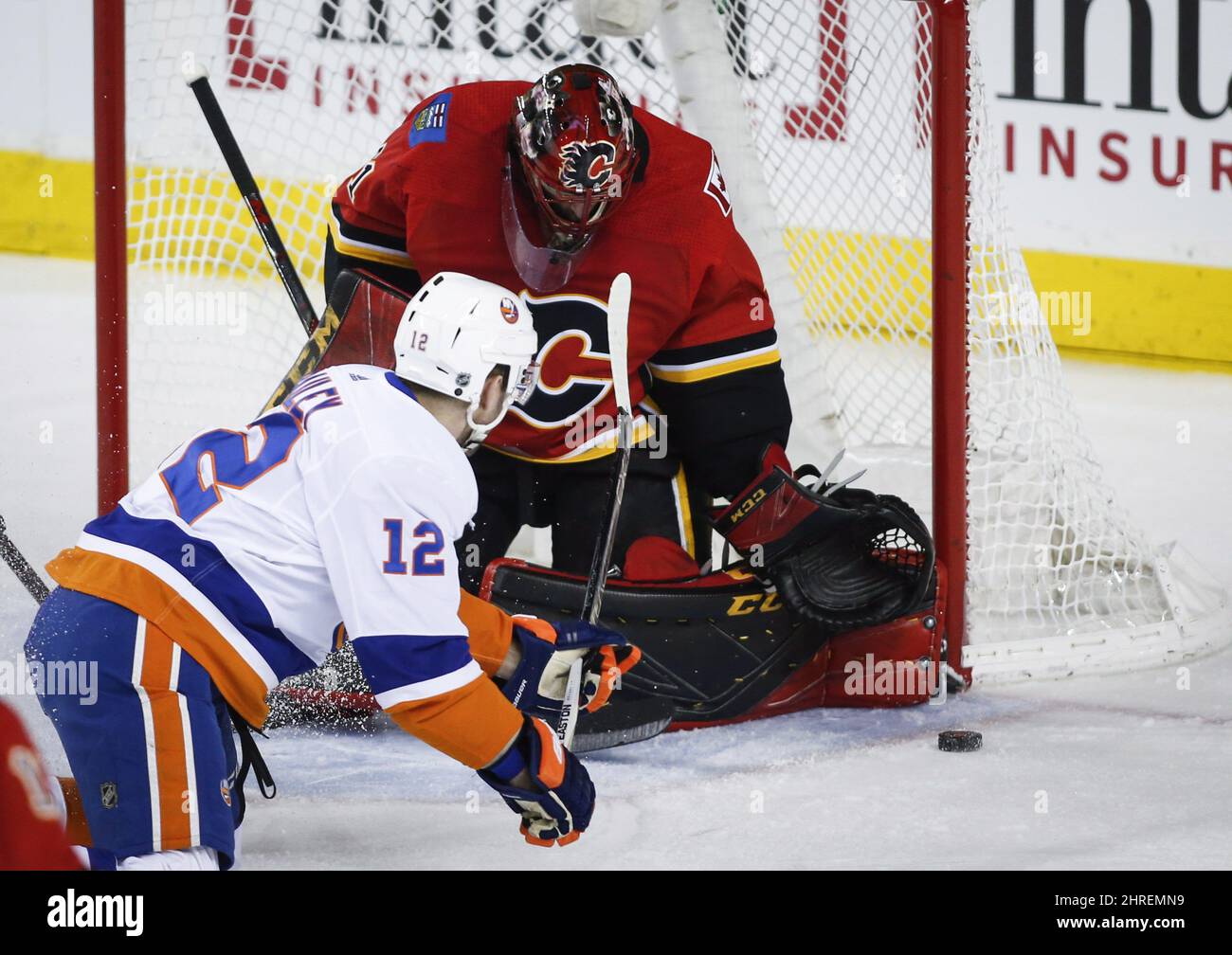 New York Islanders' Josh Bailey, centre, has his shot blocked by ...