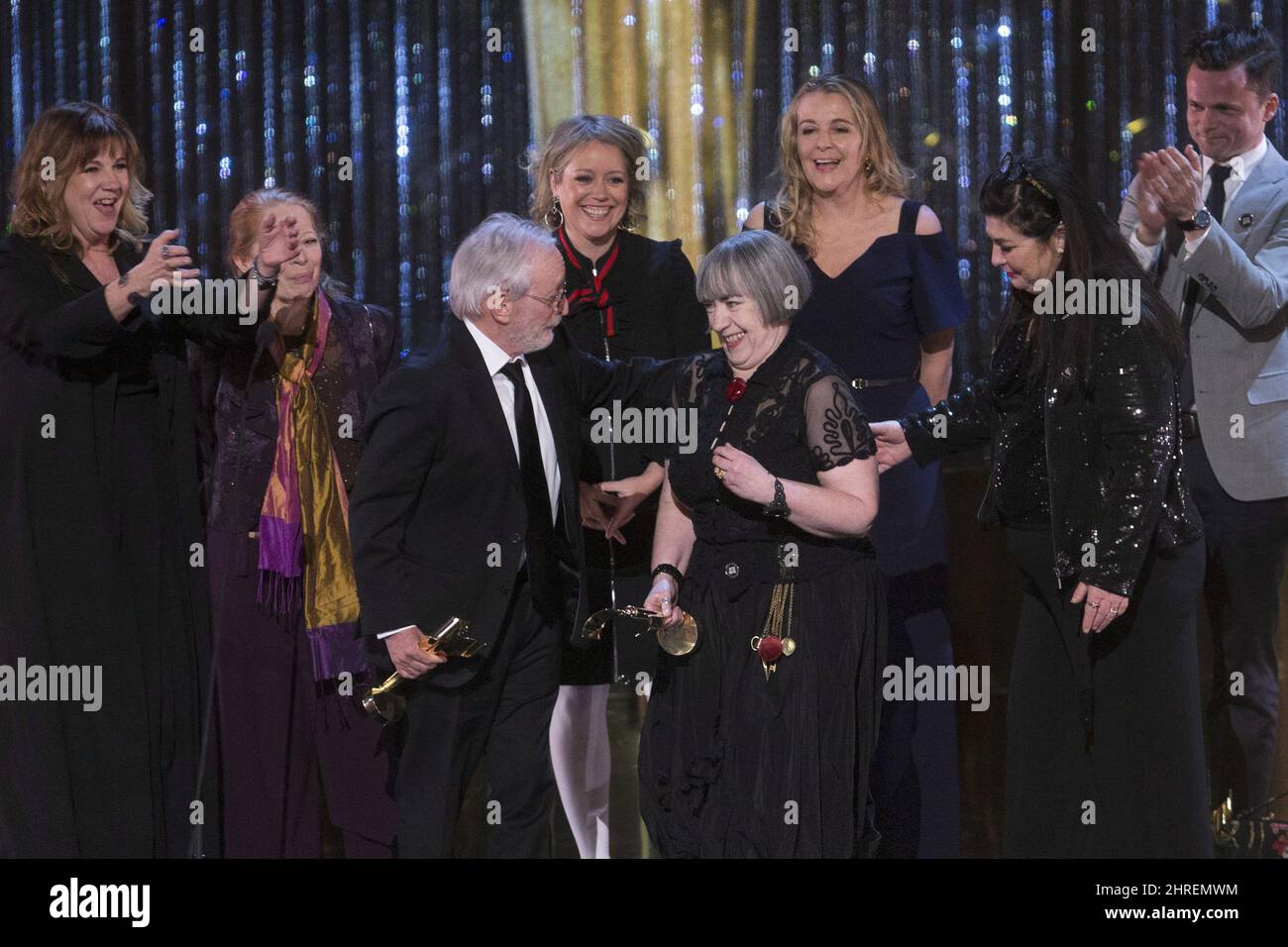 Director Aisling Walsh (centre) makes her way to the microphone after ...