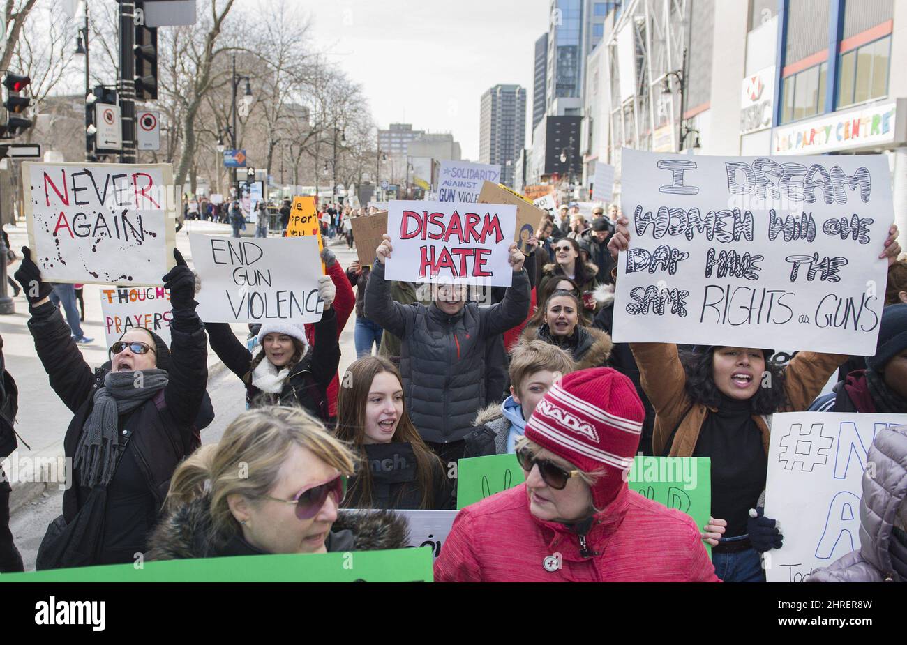 People hold up signs during a 'March of Our Lives' rally to show ...