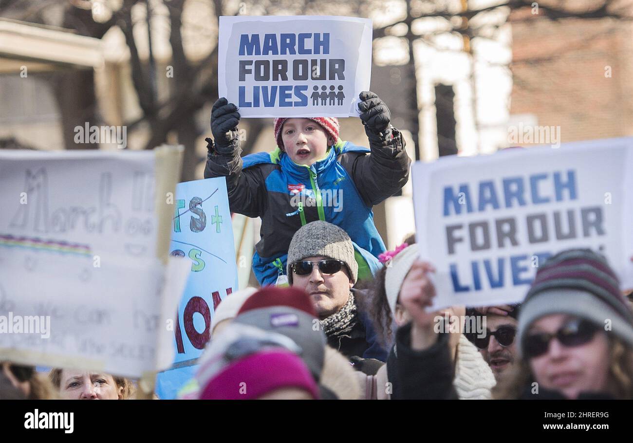 A young boy holds up a sign during a 'March for Our Lives' rally to ...