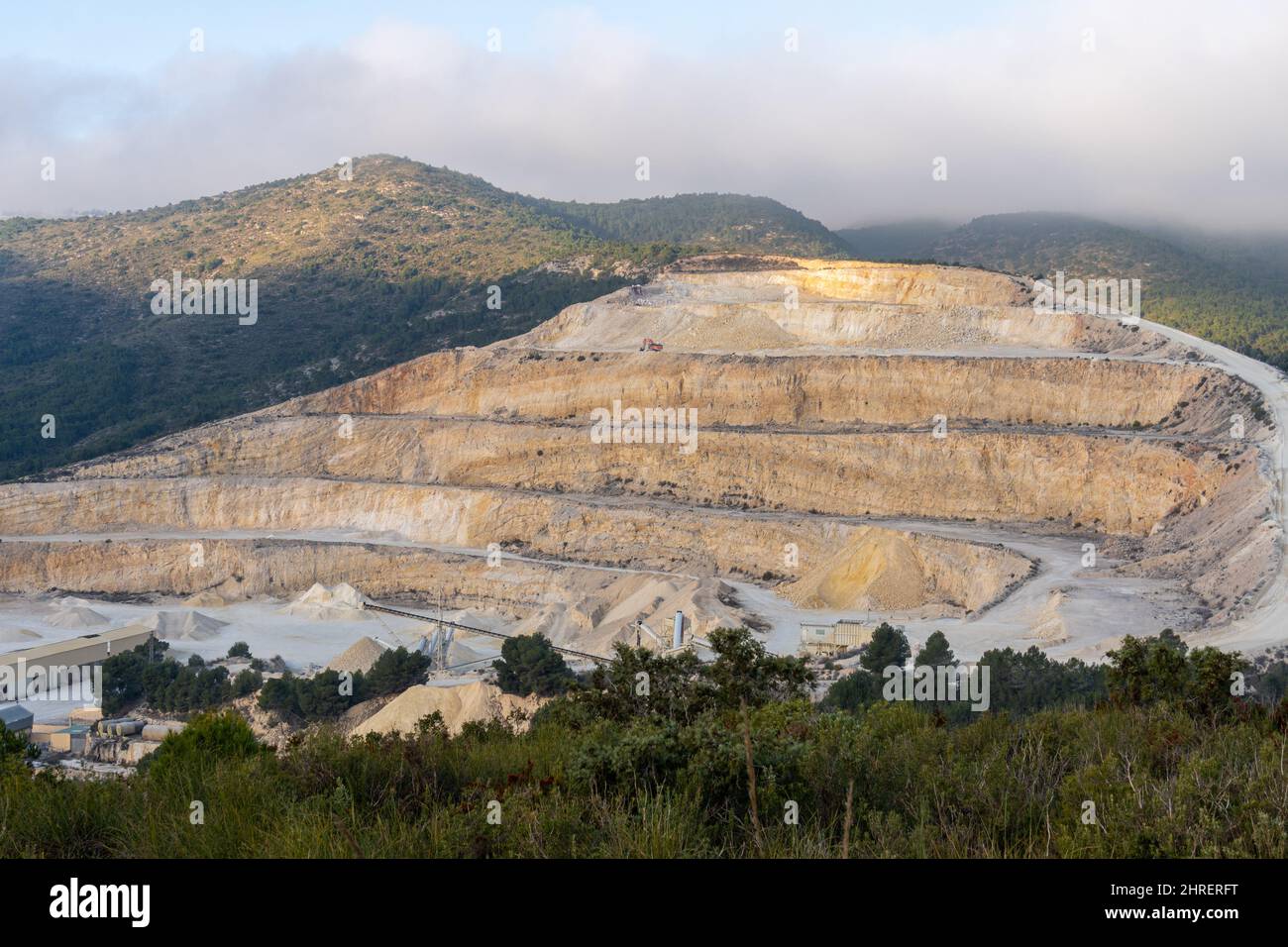 Beautiful landscape of a mine in green forests on a rocky area on a ...