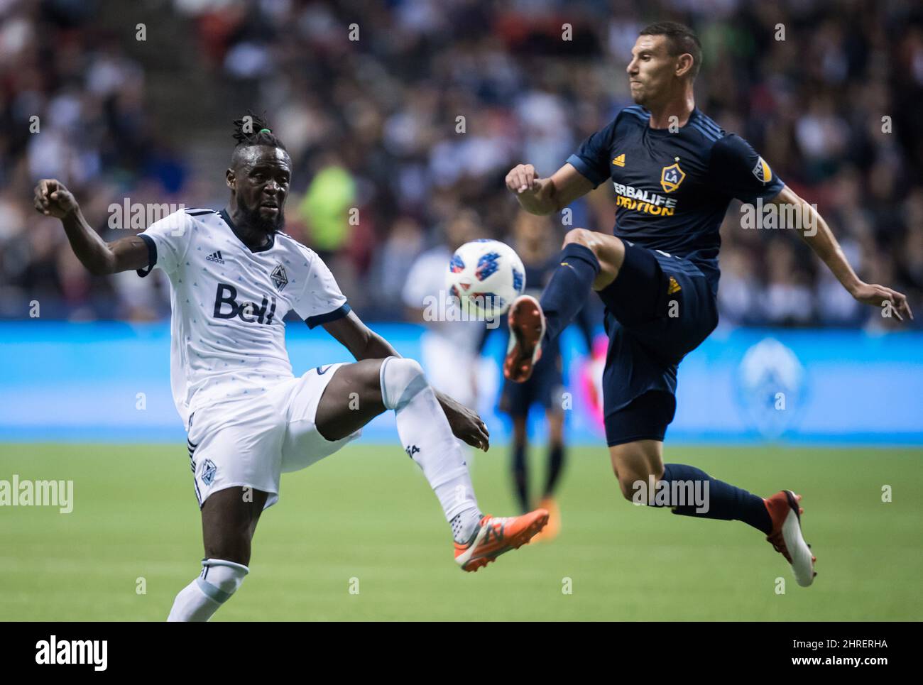 Vancouver Whitecaps' Kei Kamara, left, and Los Angeles Galaxy's Daniel ...