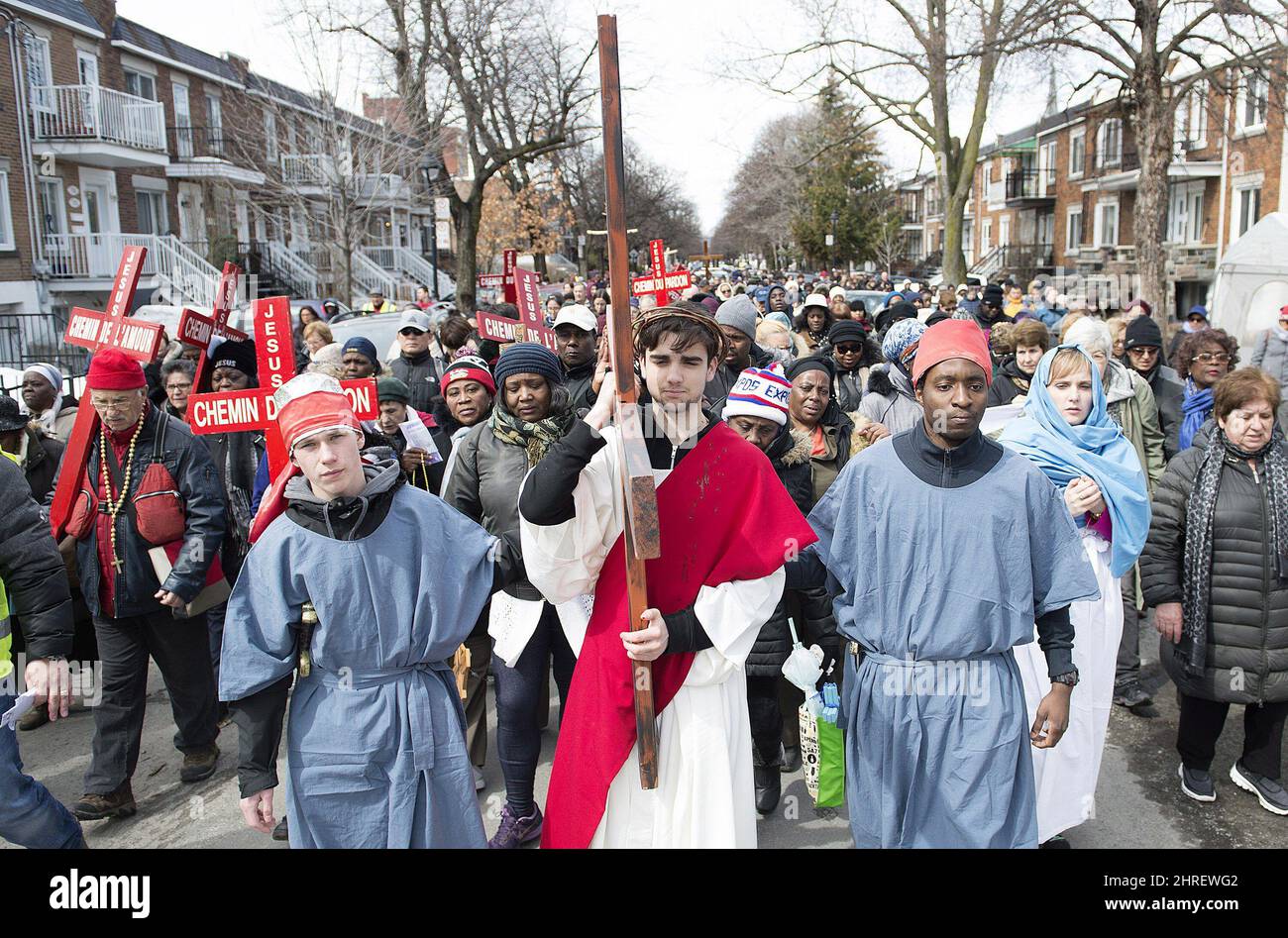 A man portrays Jesus Christ as the faithful participate in a Way of the ...