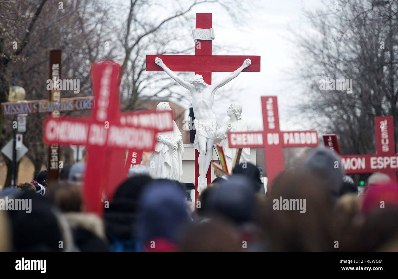 The faithful participate in a Way of the Cross march in Montreal ...