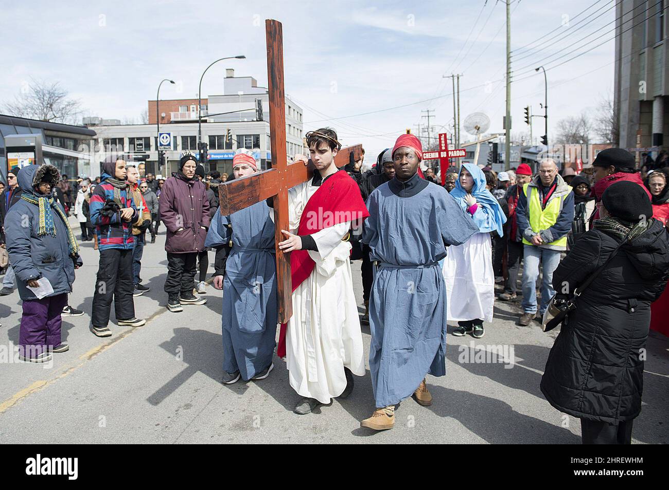 A man portrays Jesus Christ as the faithful participate in a Way of the ...