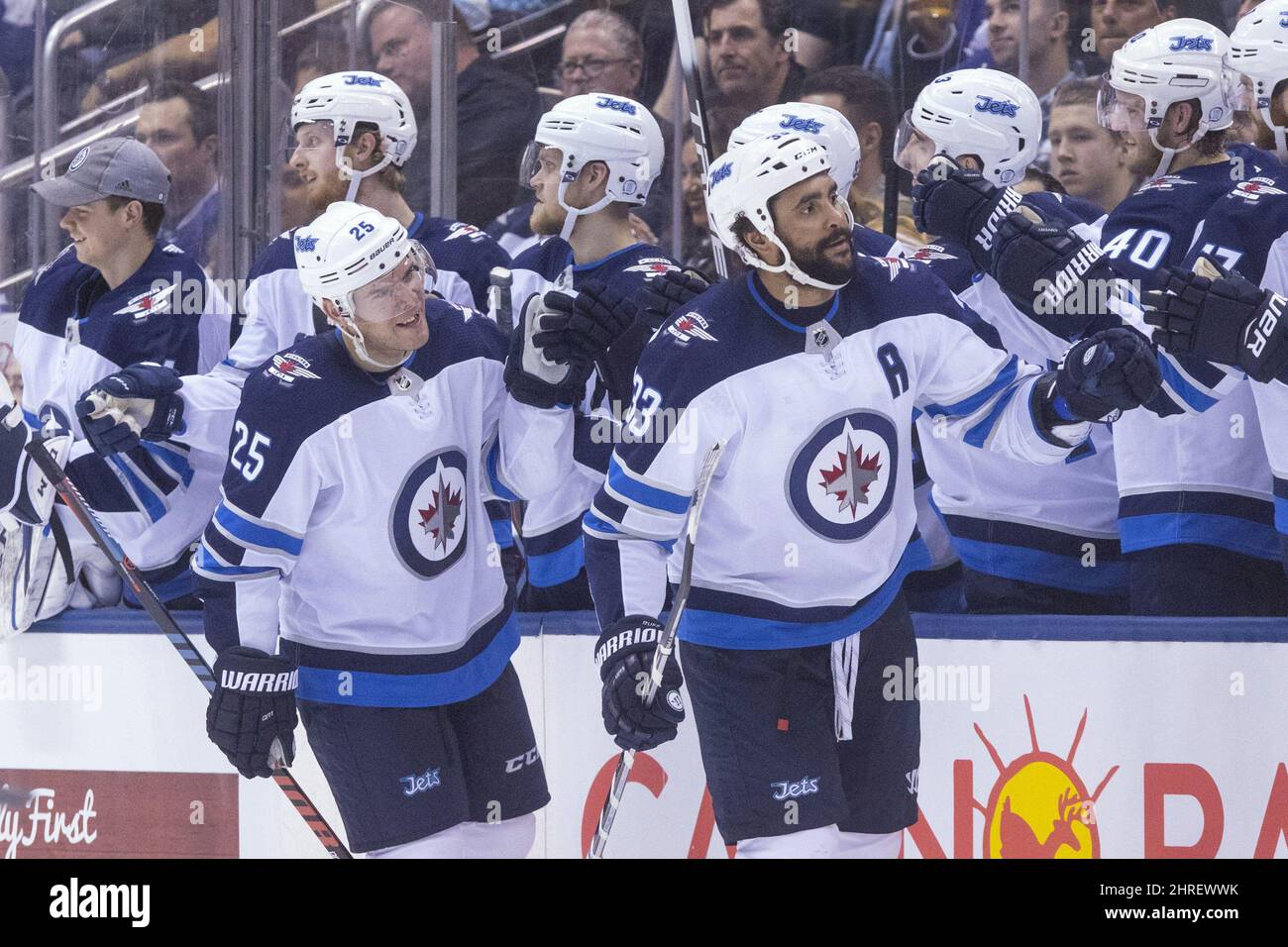 Winnipeg Jets' Dustin Byfuglien (33) skates along the bench as he ...