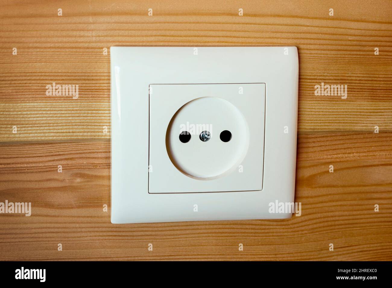 Indoor socket built into the wall sheathed with wooden lath Stock Photo ...