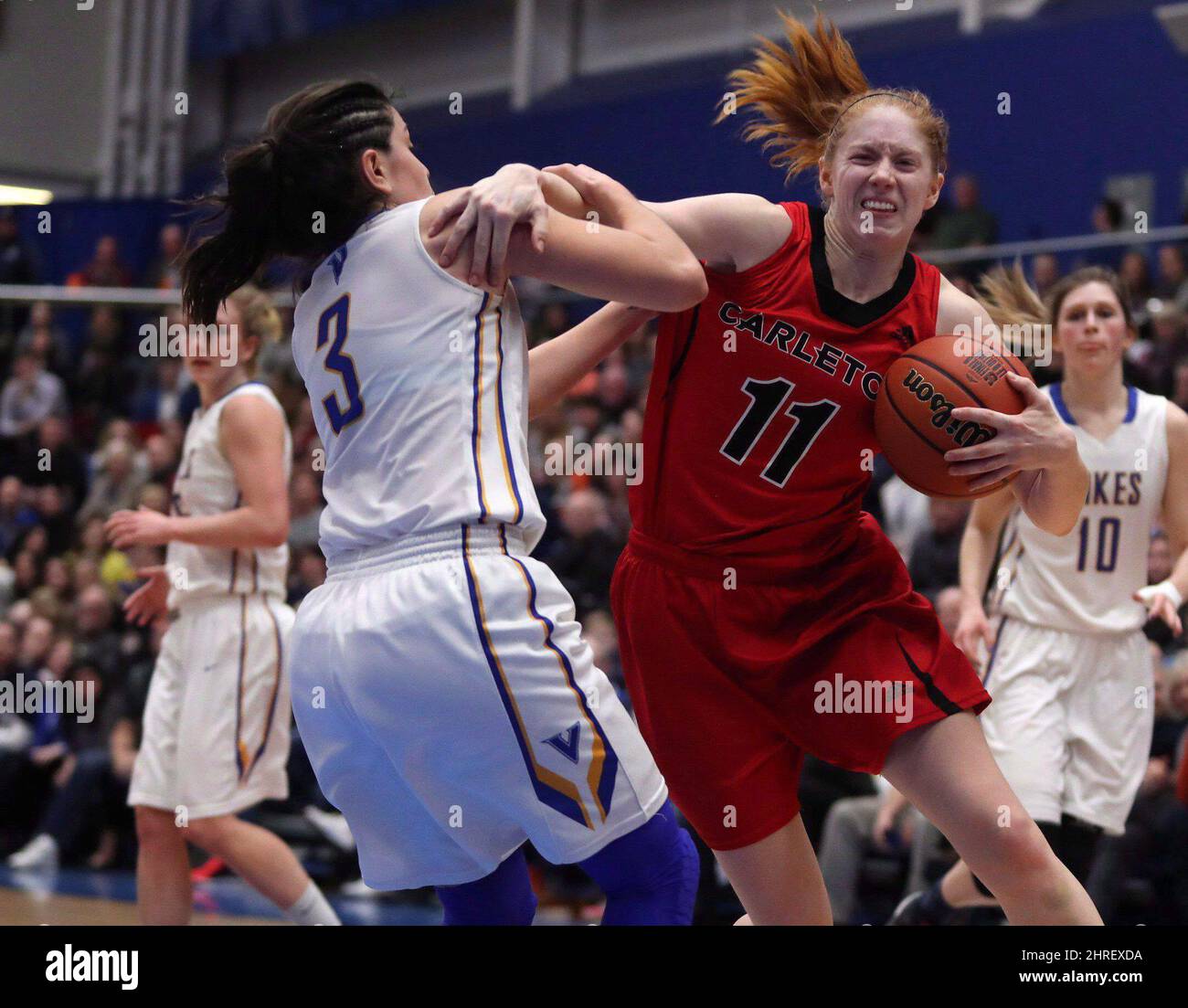 Carleton Ravens' Catherine Traer muscles her way through Victoria Vikes' Amira Giannattasio ...