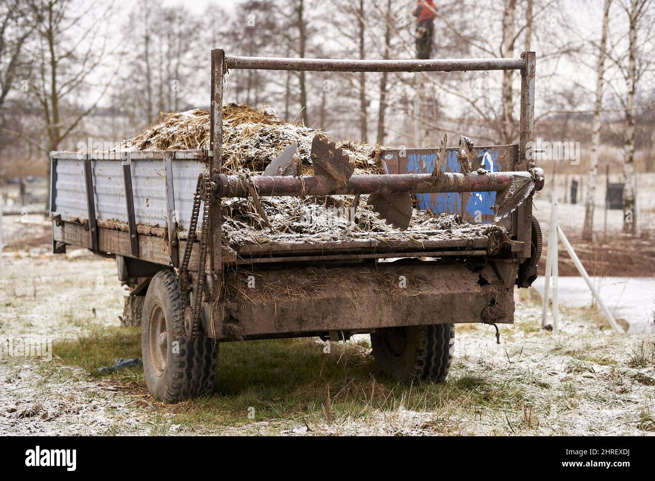 Old rusty cart filled with waste in the Szlak Ginacych Zawodow park ...