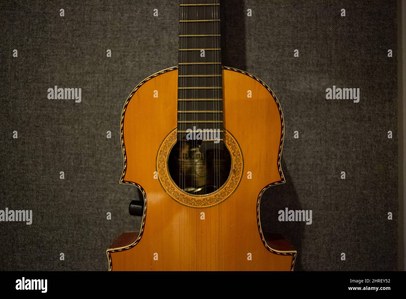 Closeup of the ten-string guitar on the gray textured surface Stock ...
