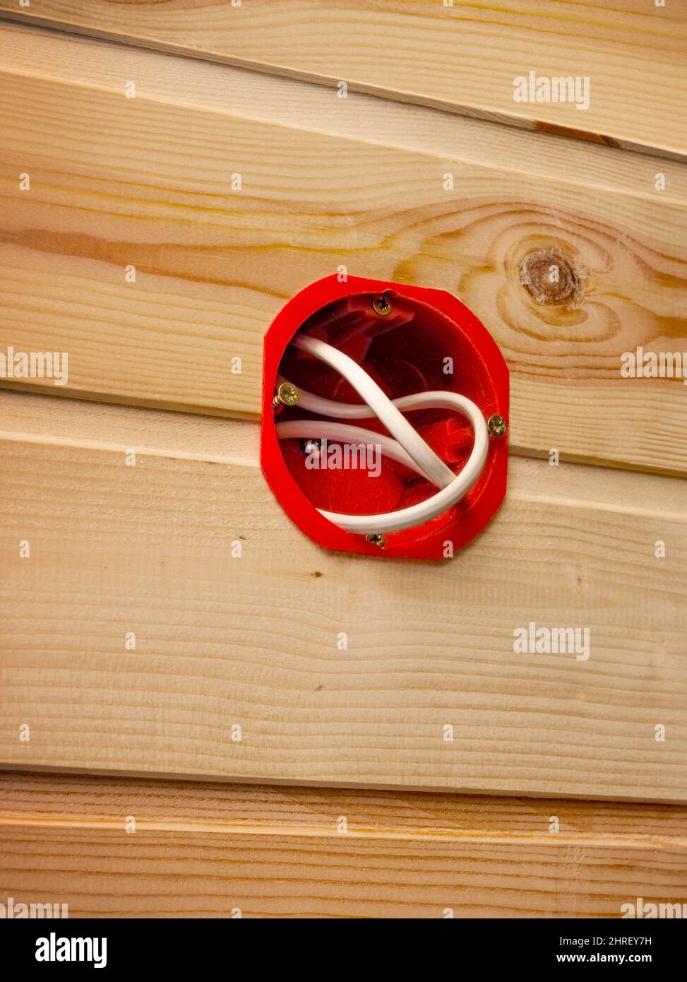 Plastic nest for an indoor socket in a wall sheathed with wooden lath ...