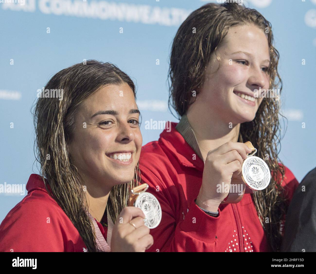 Canada's Meaghan Benfeito (left) and Caeli McKay hold up their silver ...