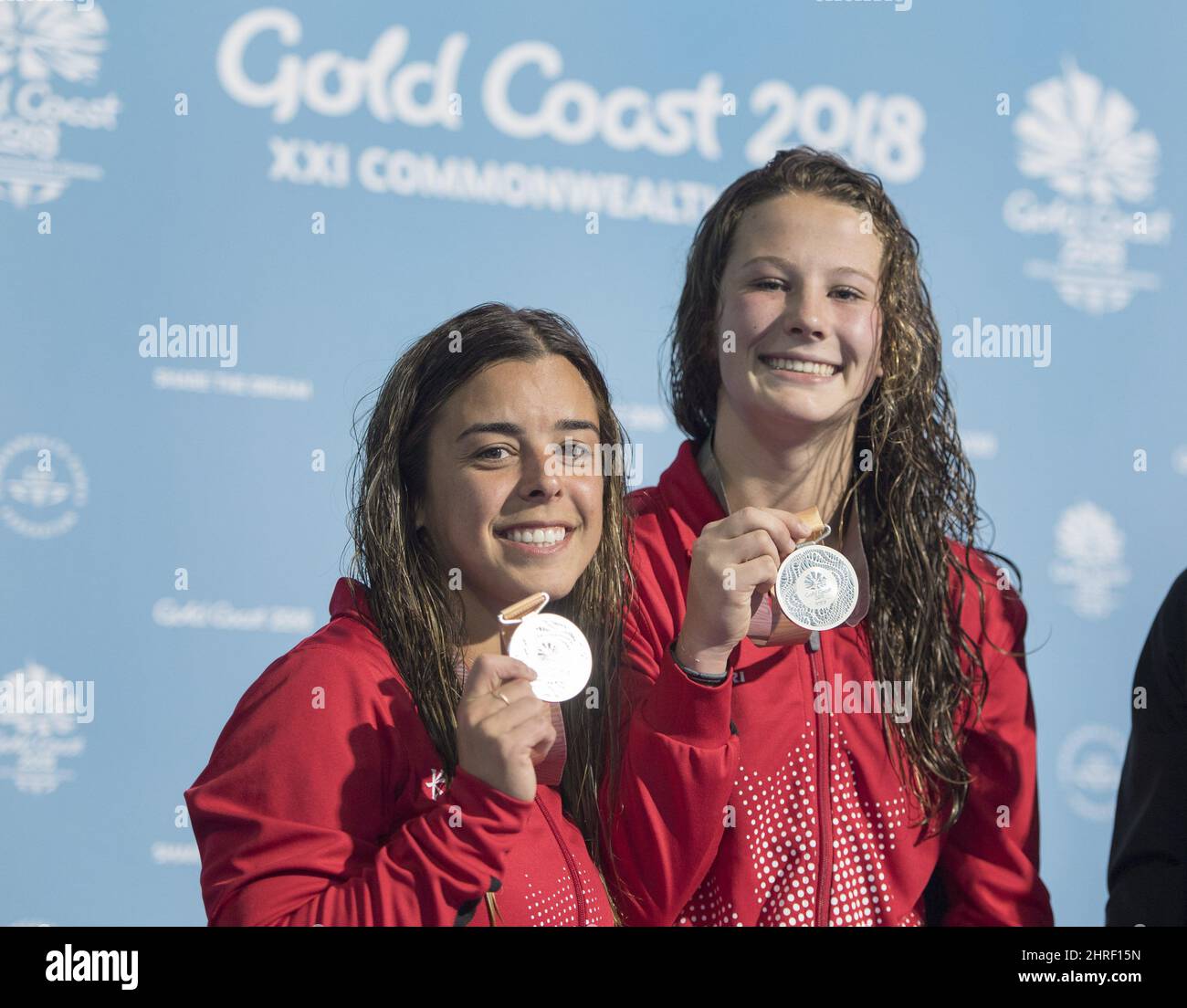 Canada's Meaghan Benfeito (left) and Caeli McKay hold up their silver ...