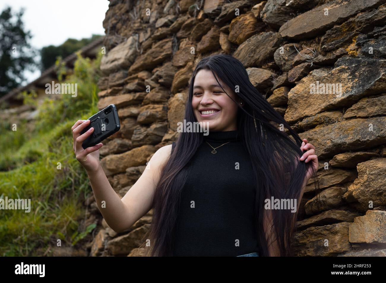 Young female model taking selfies hi-res stock photography and images ...