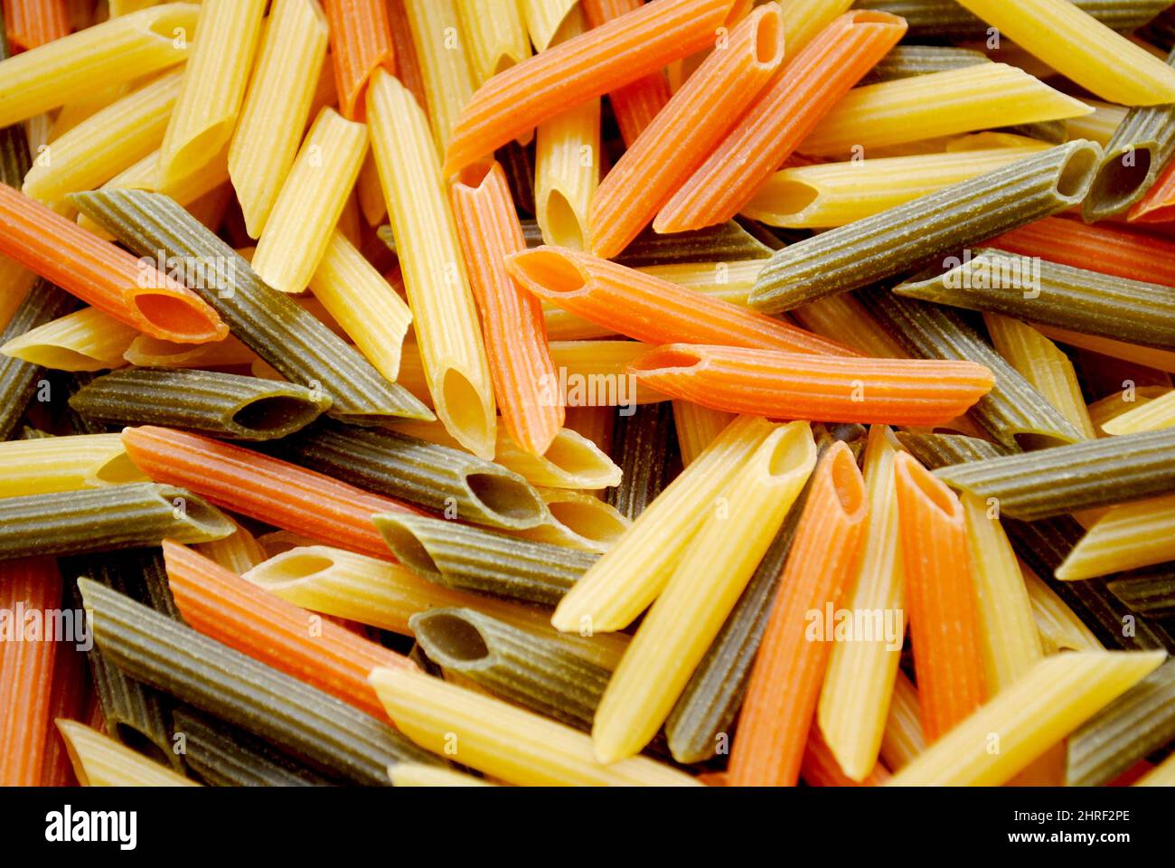 Closeup of Raw Cylinder-shaped Penne Pasta Noodles in Three Colors ...