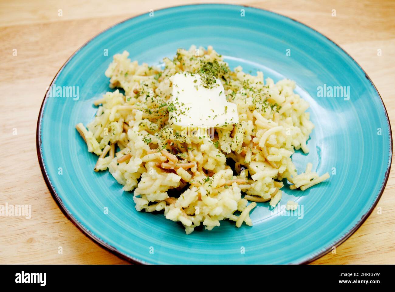 Steamed Wild Rice with Vermicelli Topped with Butter and Parsley Stock ...