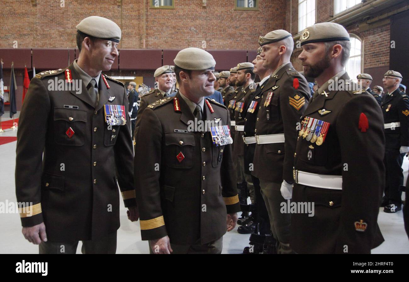 Outgoing commander of CANSOFCOM Major-General Mike Rouleau, centre, and ...