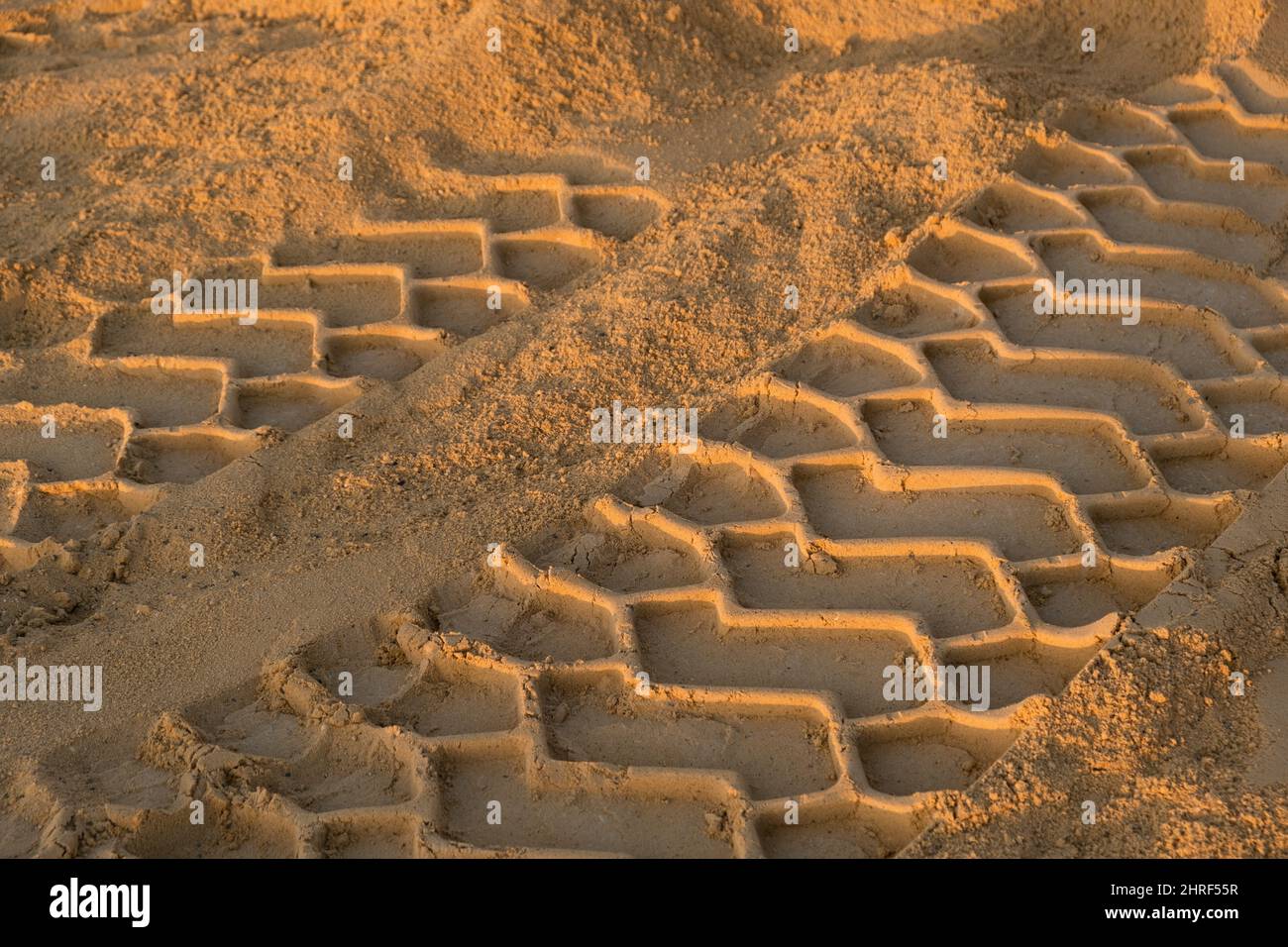 Wet sand, Car tire tracks footprint on construction site Stock Photo ...