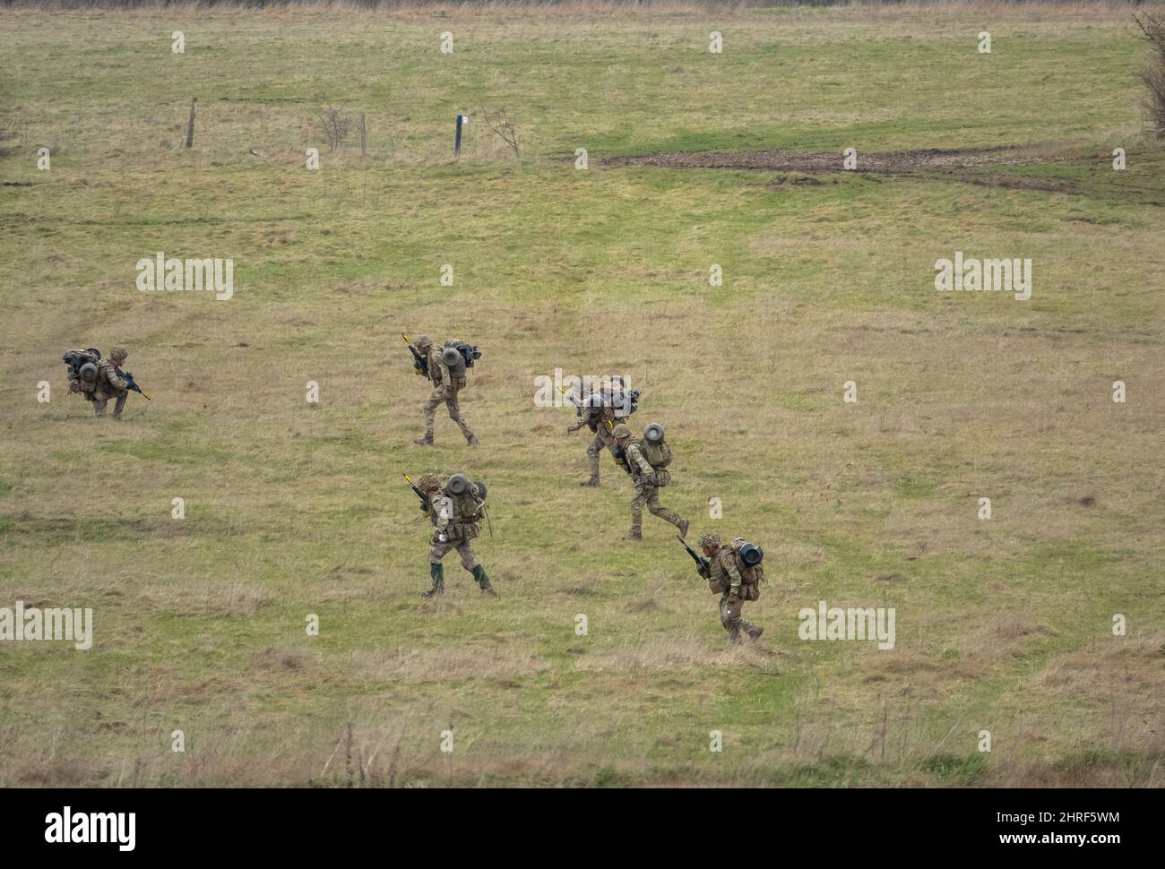 army soldiers on a military tabbing exercise with 40Kg bergen and anti ...