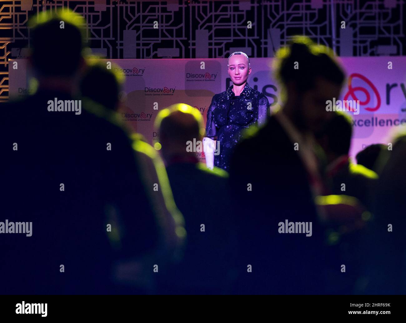 People gather to take photographs of Sophia the Robot which was created ...