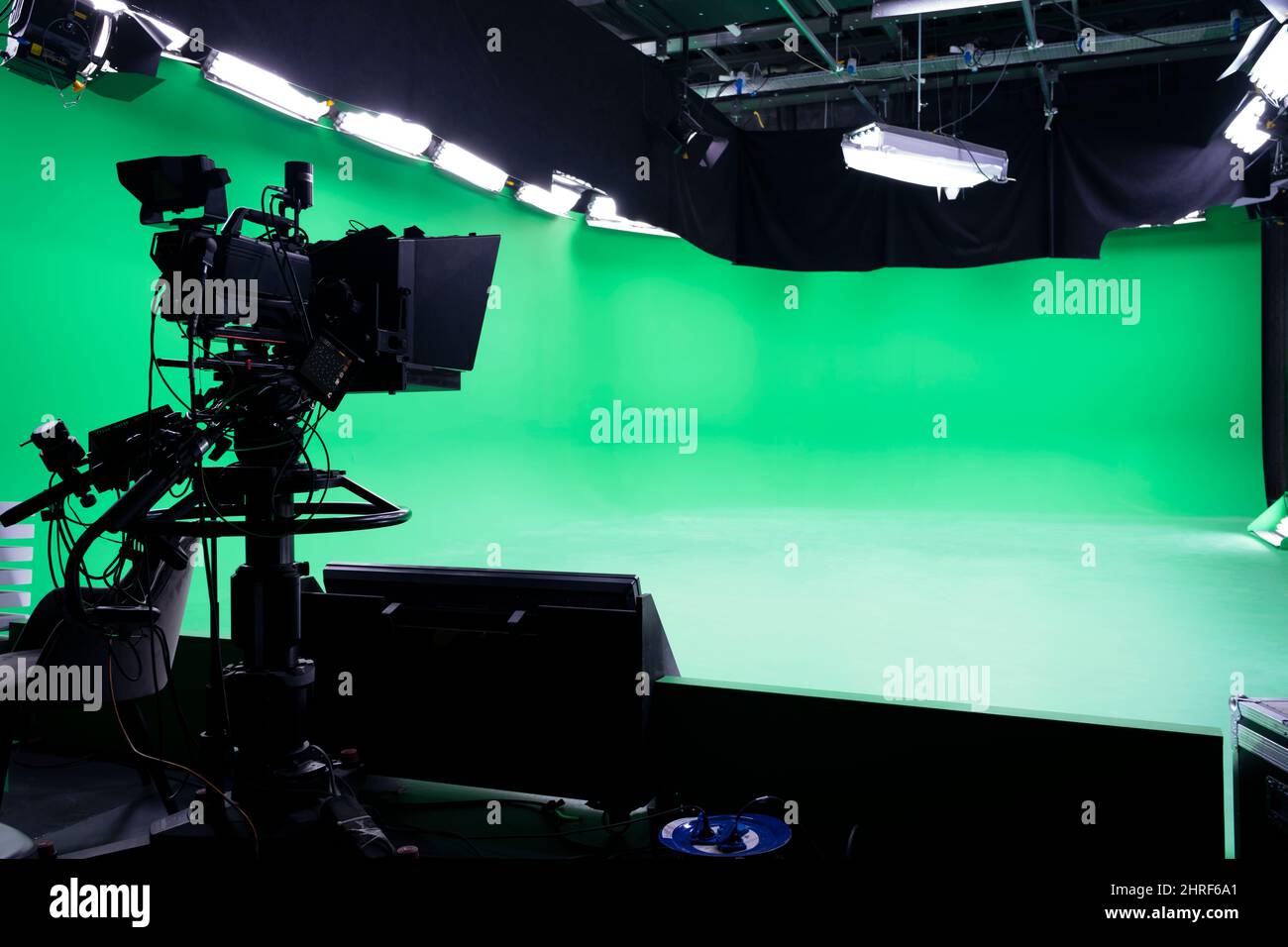 The camera on the tripod, led floodlight, spotlight, prompter and a ...