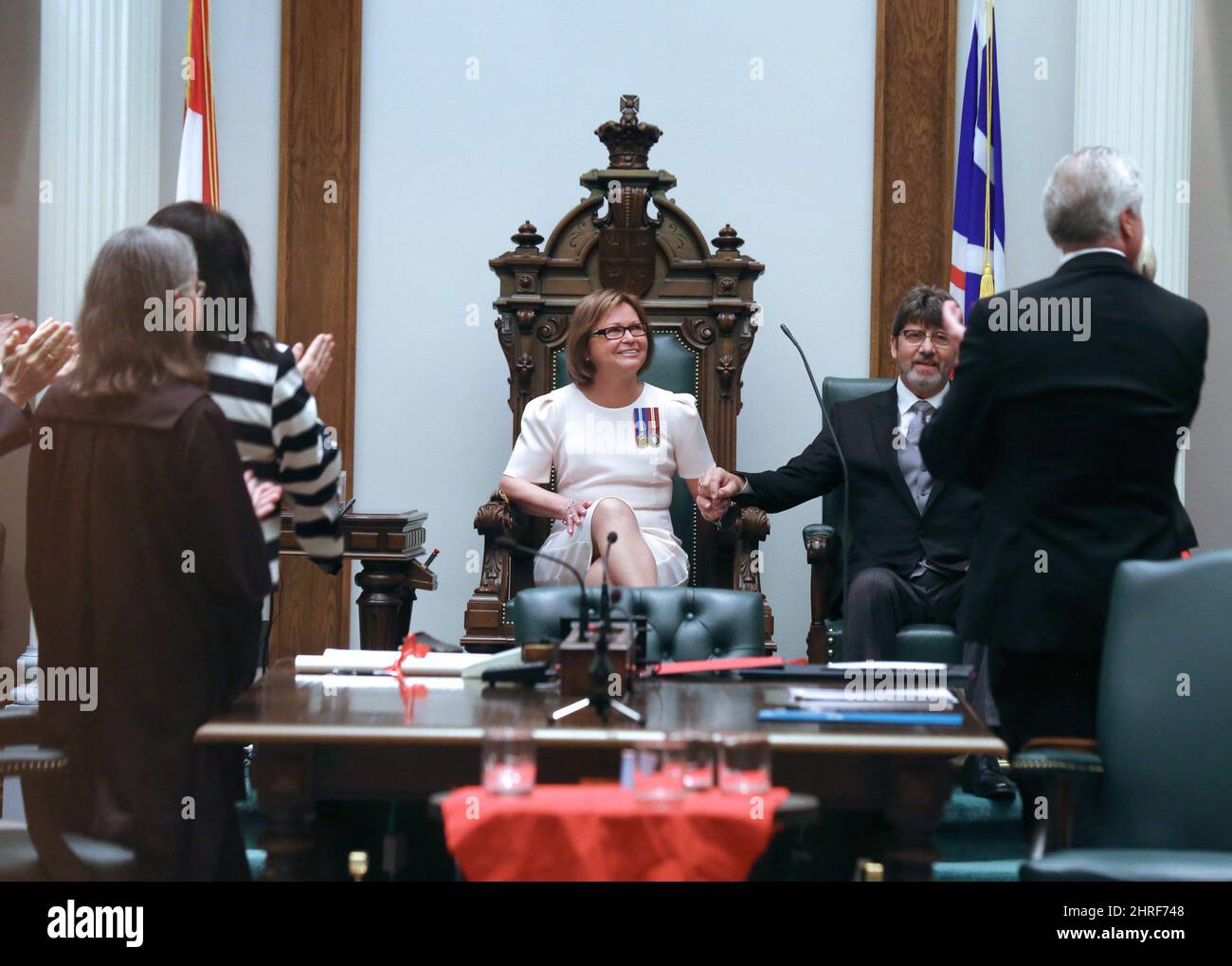 Members of the House of Assembly applaud as Judy Foote is installed as ...