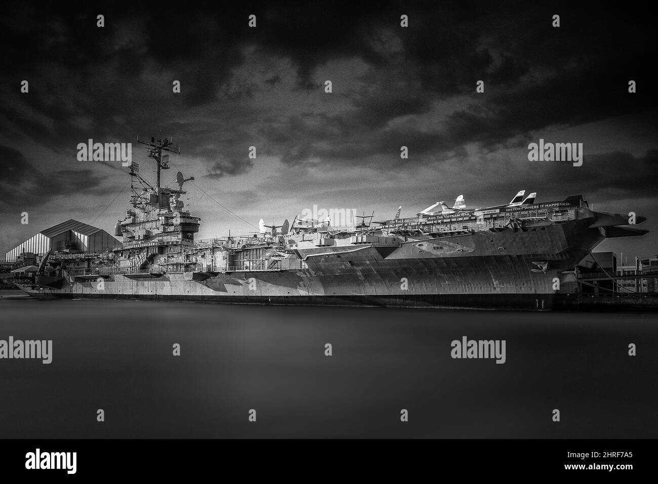 Grayscale of a ship with cloudy sky background Stock Photo - Alamy