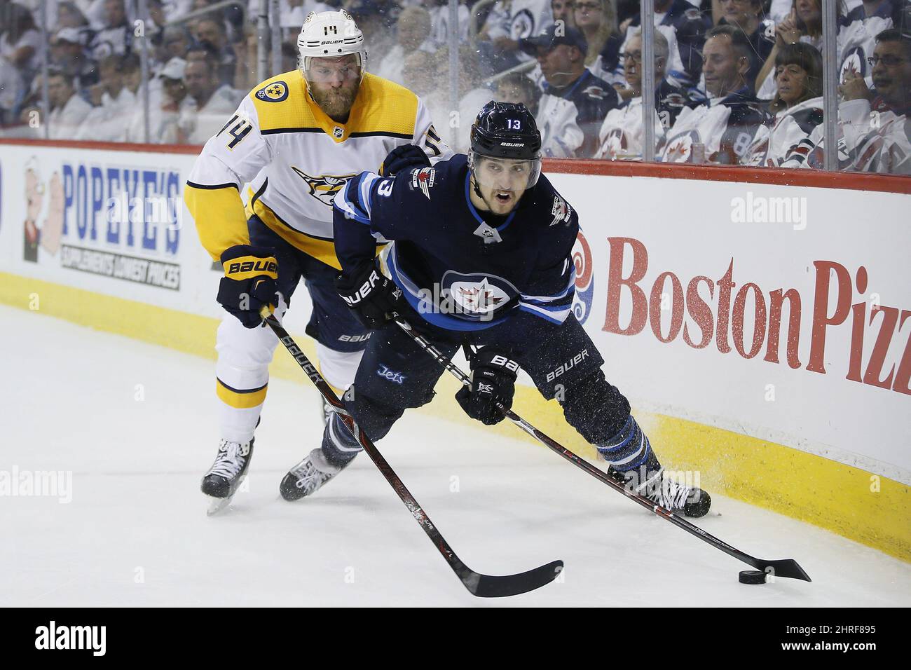 Winnipeg Jets' Brandon Tanev (13) attempts to make a pass as Nashville ...