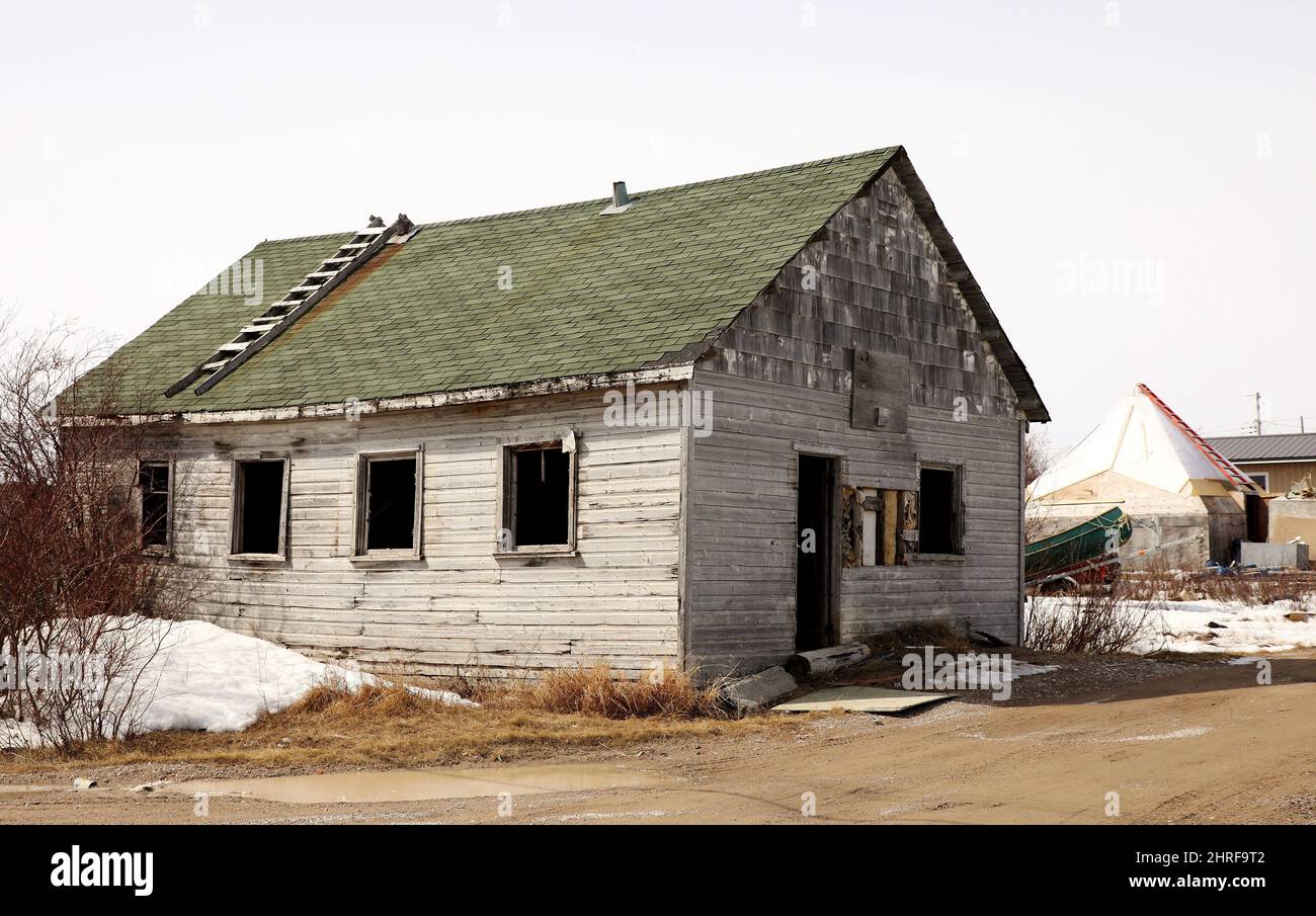 A condemned building, one of the original structures in the town, is ...