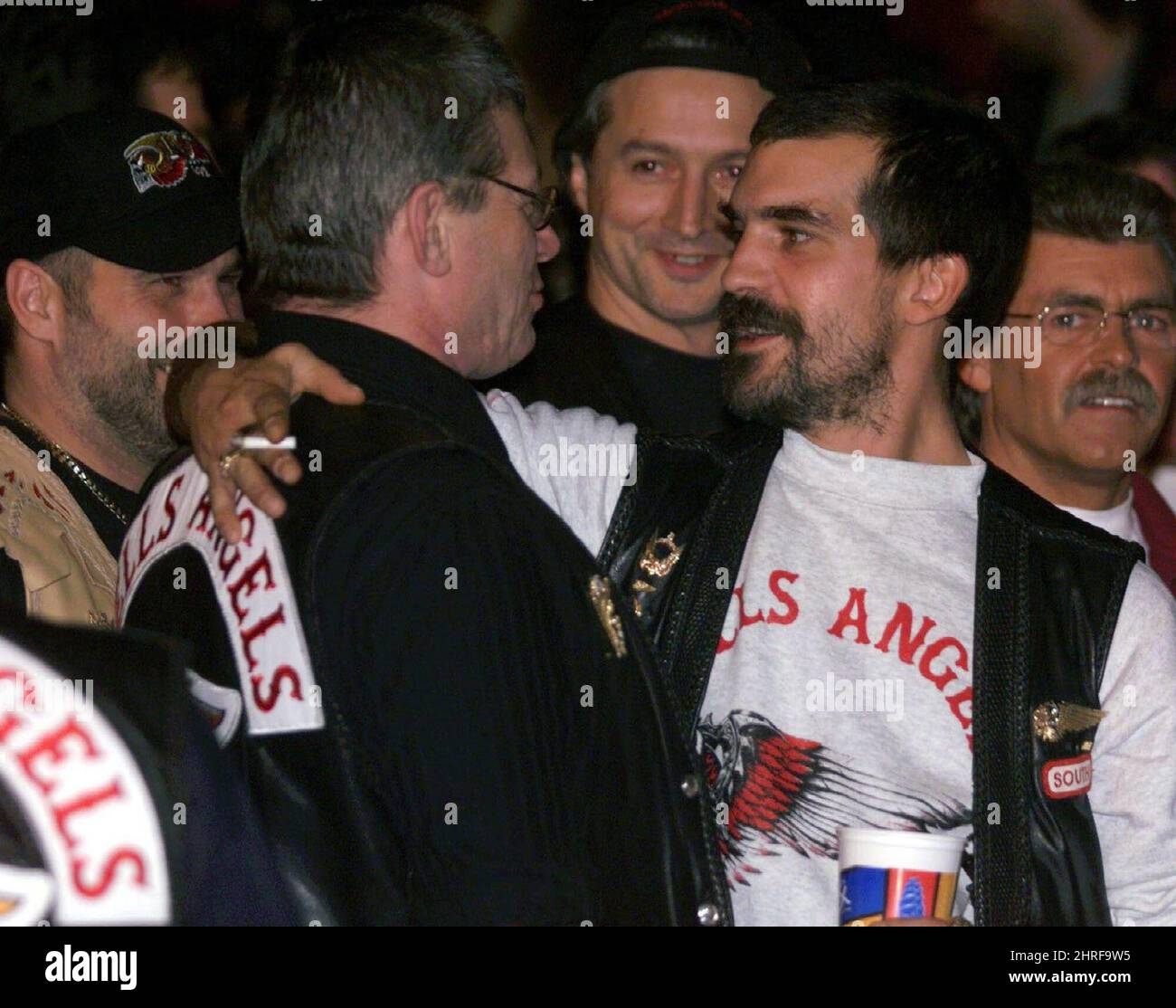 Hells Angels boss Maurice "Mom" Boucher, second left, is greeted by ...