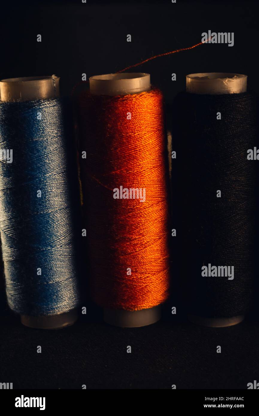 Vertical of colorful nylon threads set on a dark background Stock Photo ...
