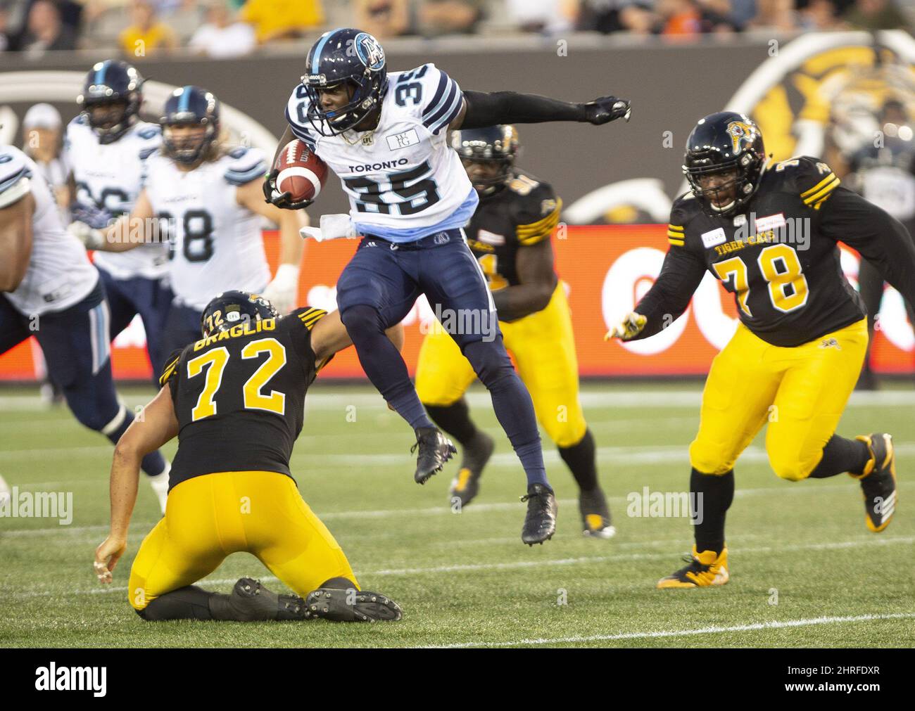 Toronto Argonauts defensive lineman Jeff Luc (35) or running back ...
