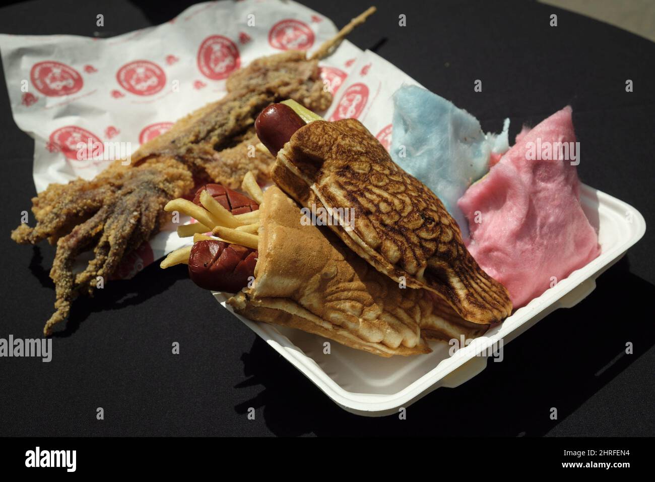 Samples of deep fried giant squid, left, cookie dough burritos, right ...
