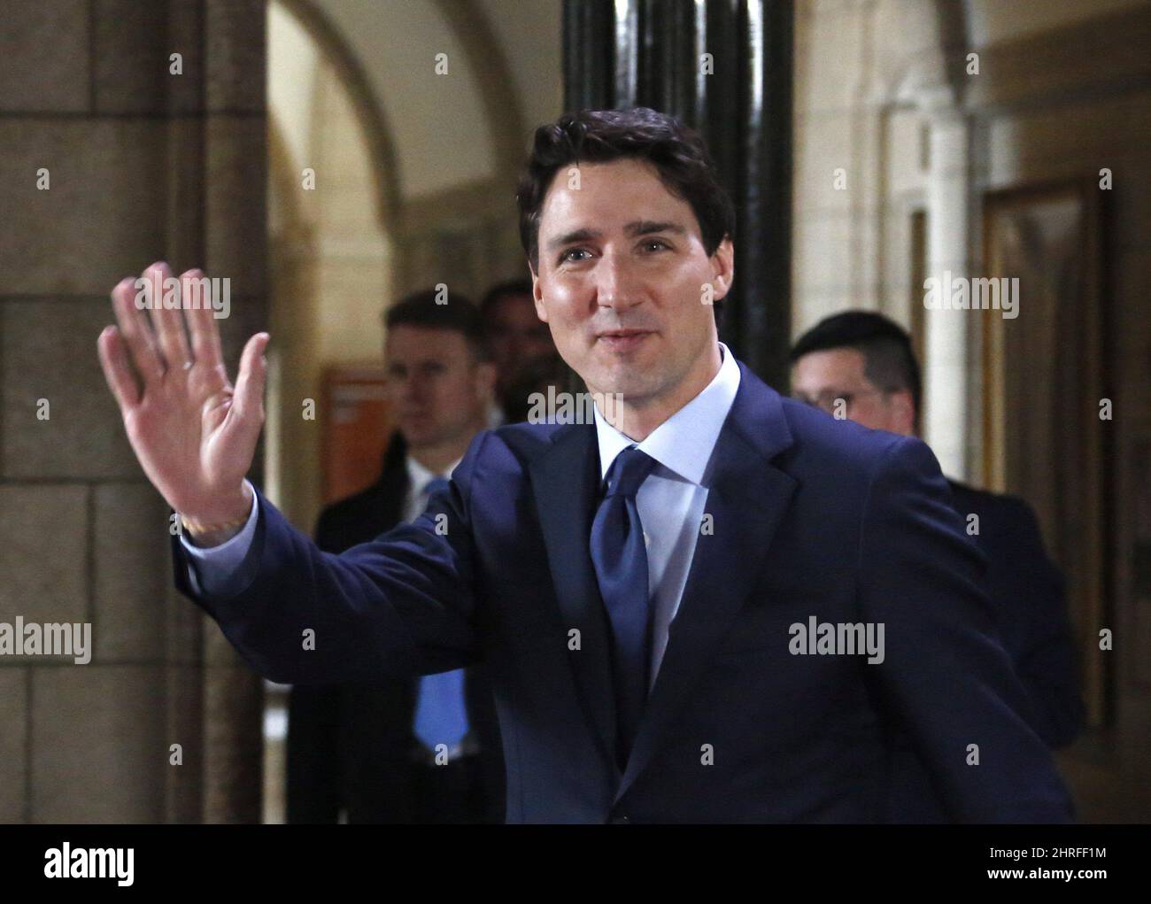 Prime Minister Justin Trudeau waves to a crowd on Parliament Hill in ...