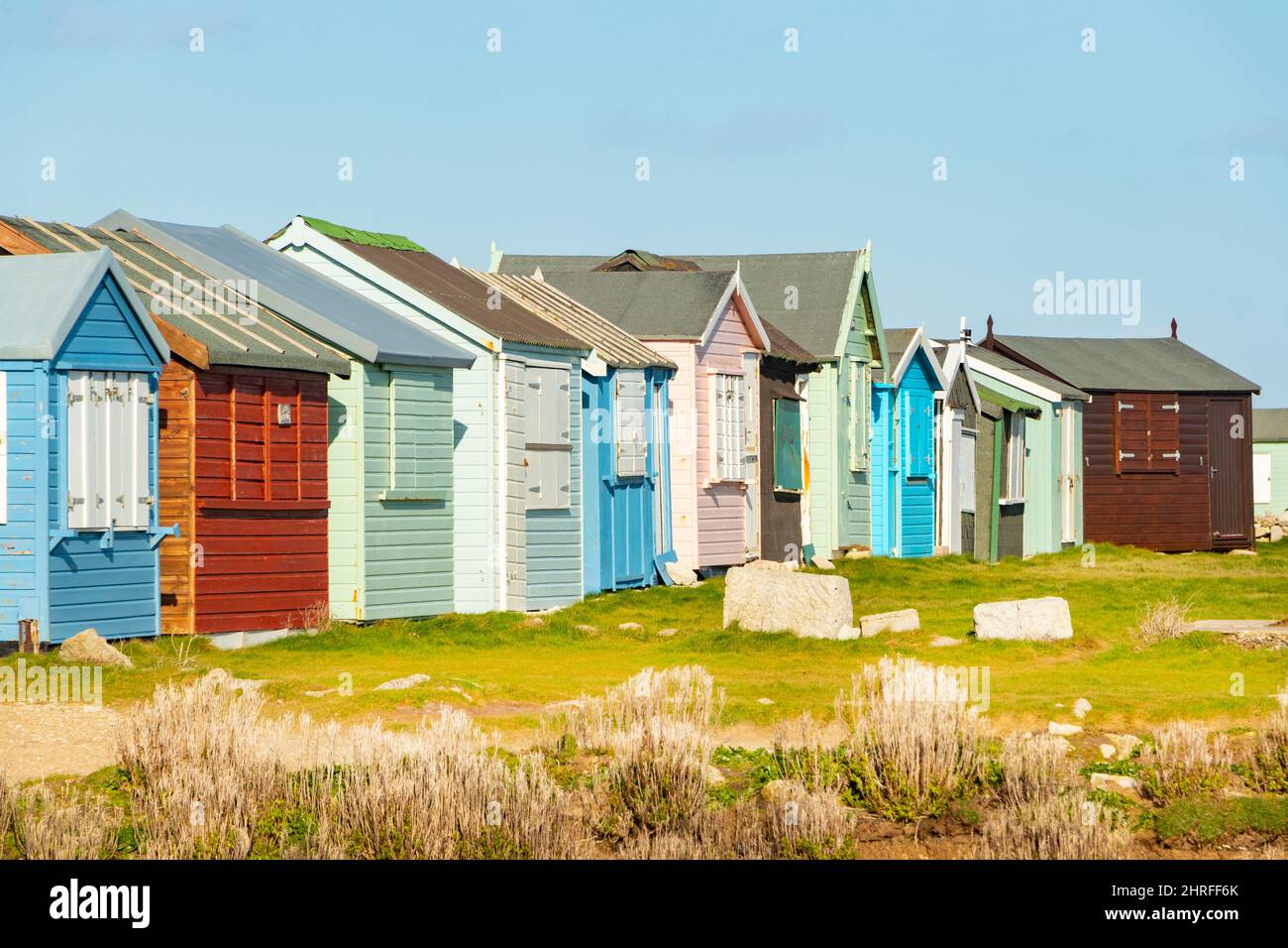 colourful beach huts or sheds on Portland Bill Dorset Stock Photo - Alamy