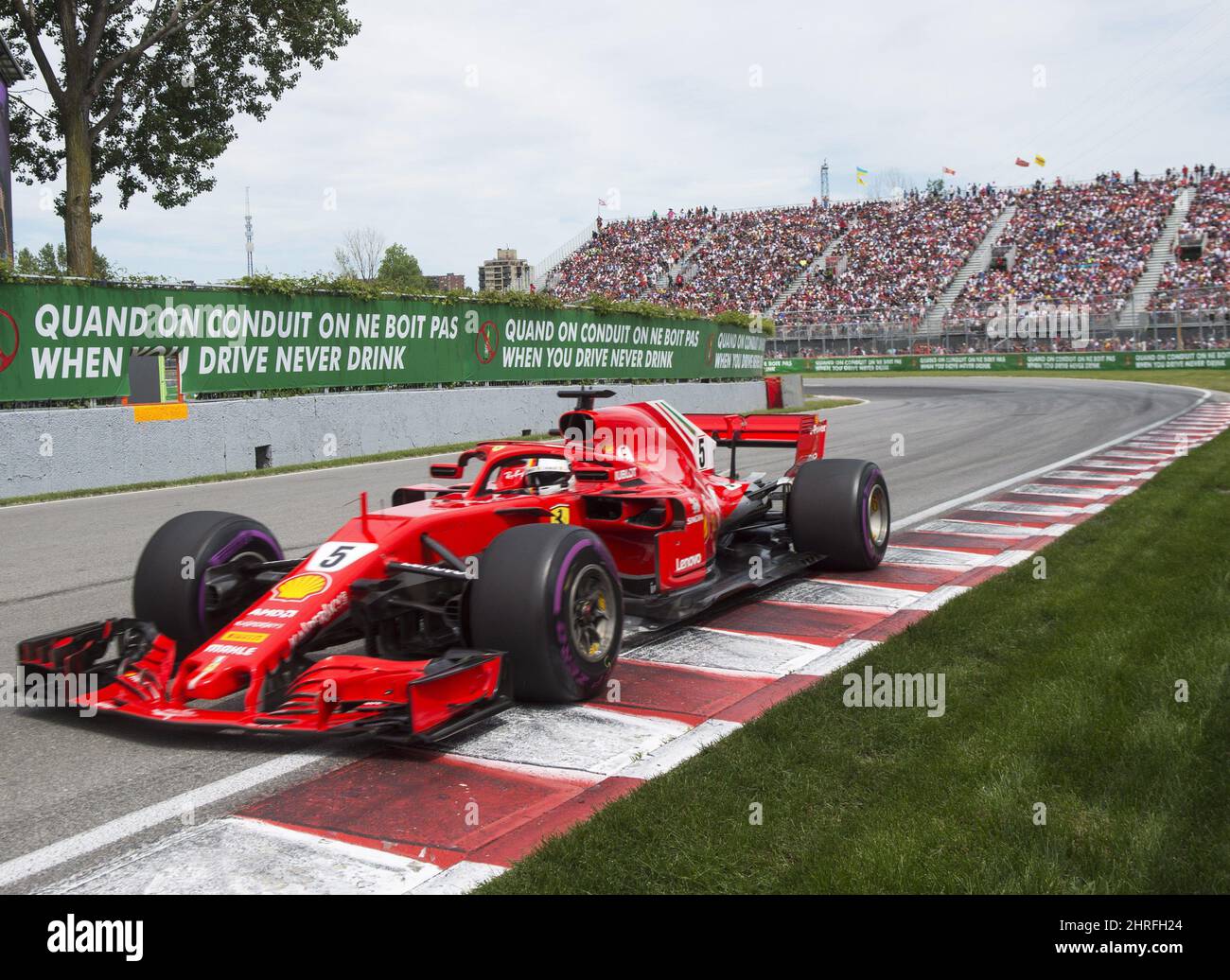 Ferrari driver Sebastian Vettel of Germany comes through the Senna ...