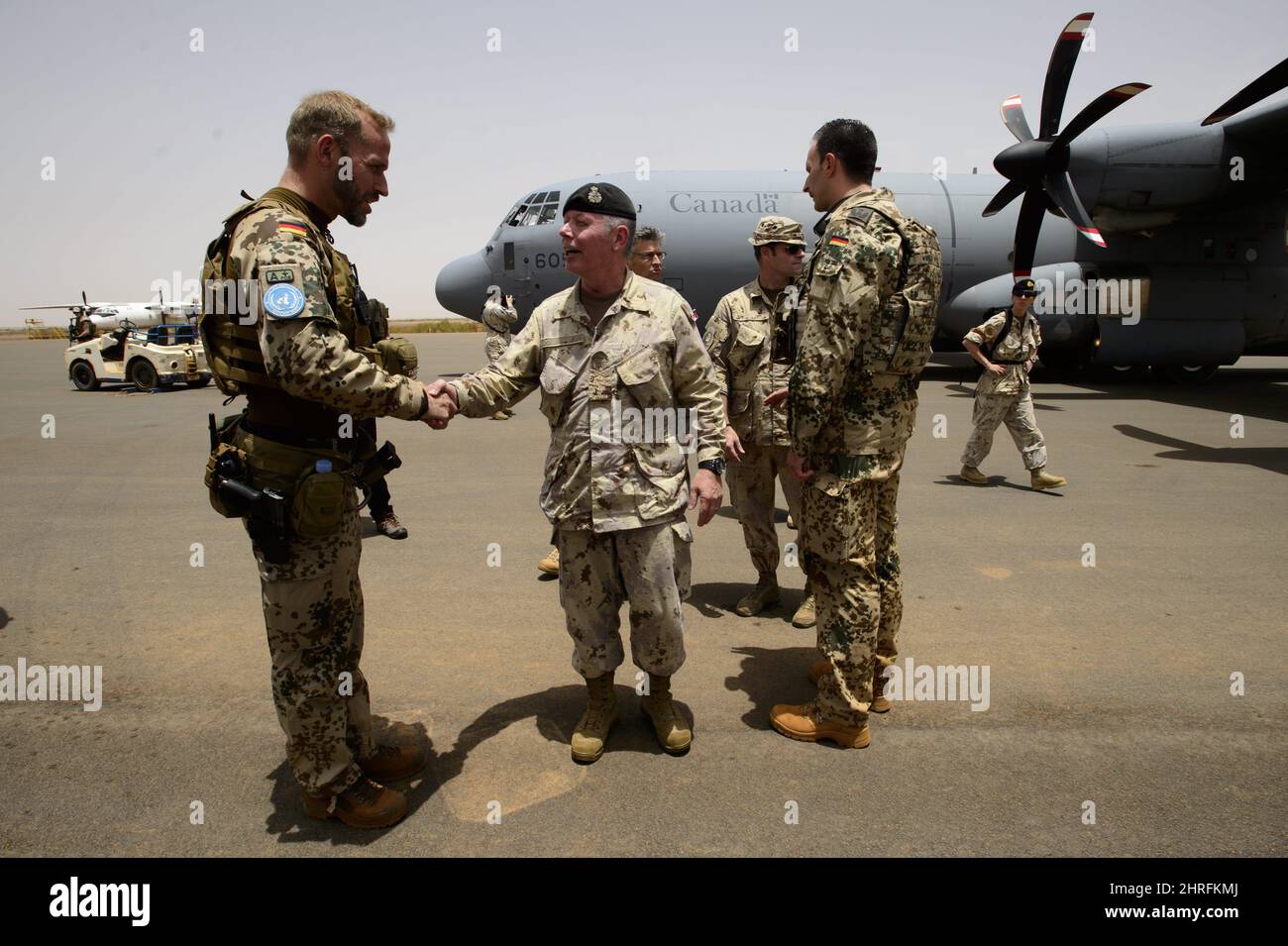 Chief of the Defence Staff General Jonathan Vance shakes hands with a ...