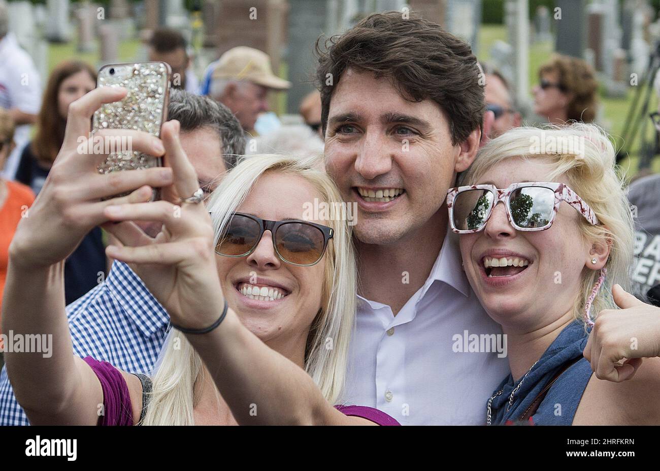 Prime Minister Justin Trudeau poses with members of the public during a ...