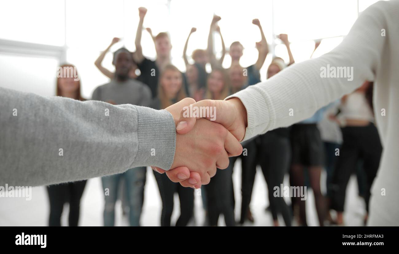 close up. young leaders greet each other with a handshake Stock Photo ...