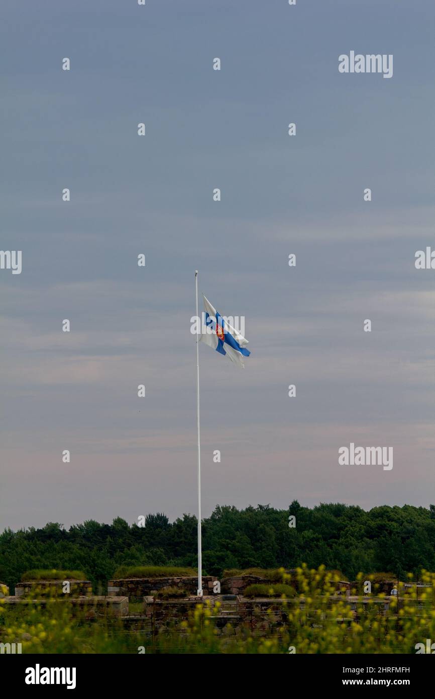 The Finnish flag flying above Suomenlinna fort Helsinki, Finland Stock ...
