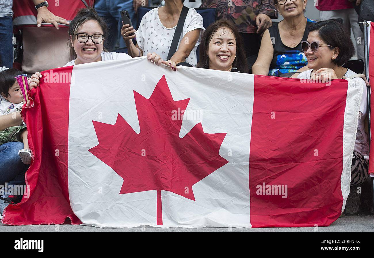 Members of the crowd look on during a Canada Day parade in Montreal ...