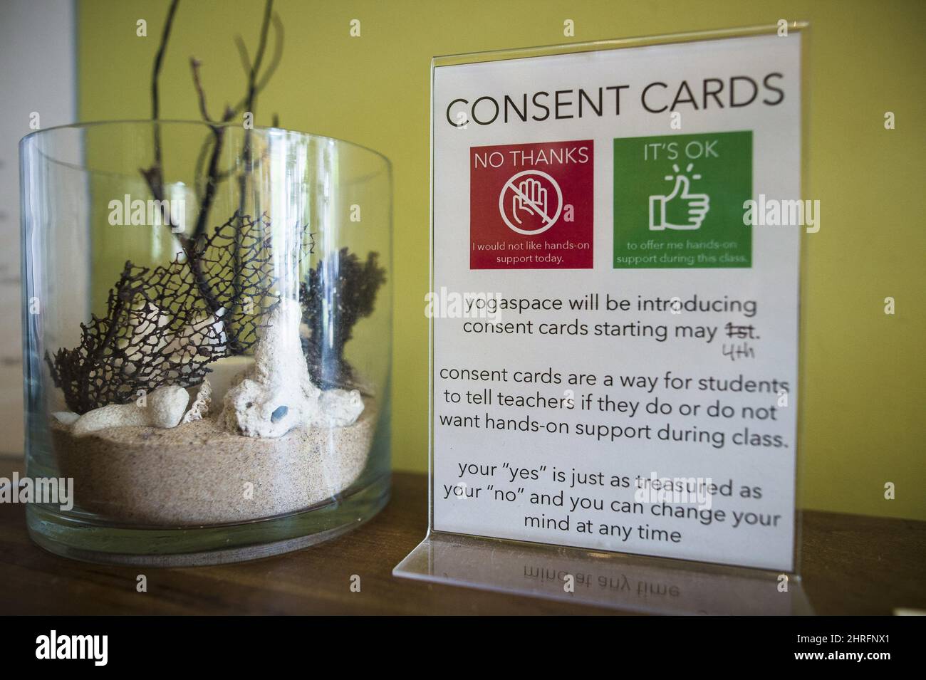 A display notice on how consent cards are used at Yogaspace in Toronto ...