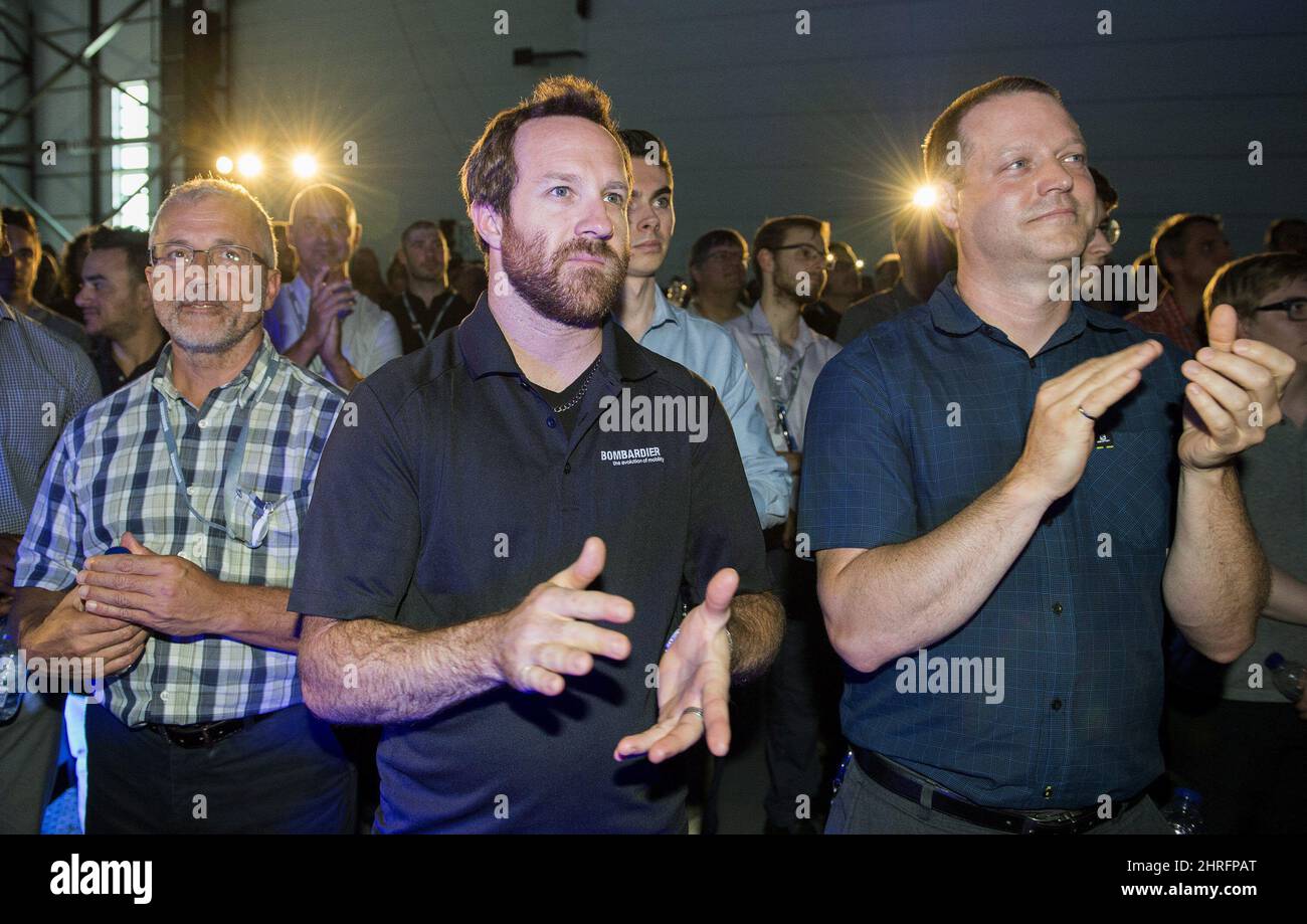 Bombardier employees look on during an event in Mirabel, Que ...