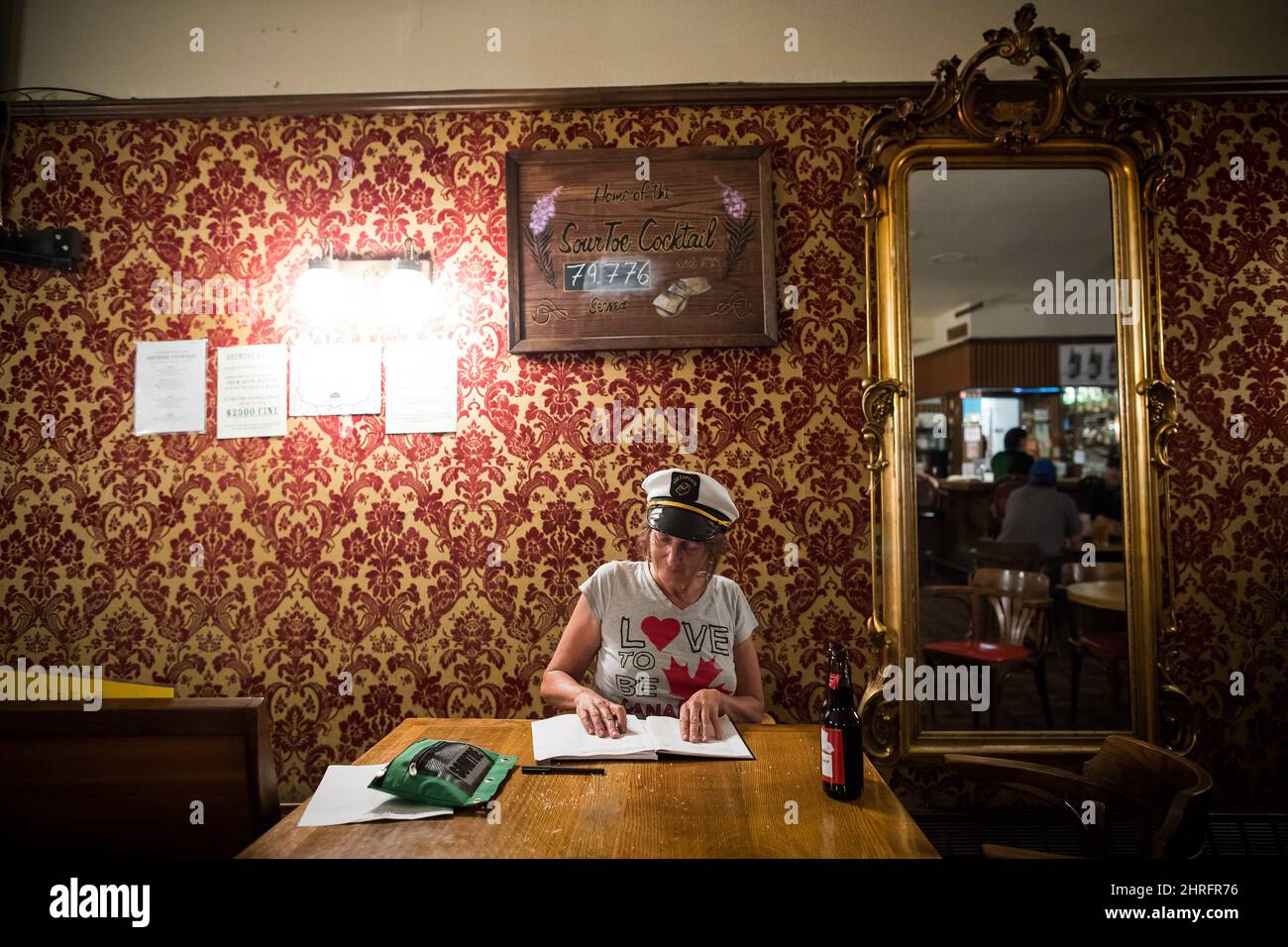 "Toe Captain" Sue Taylor performs some bookkeeping after administering ...